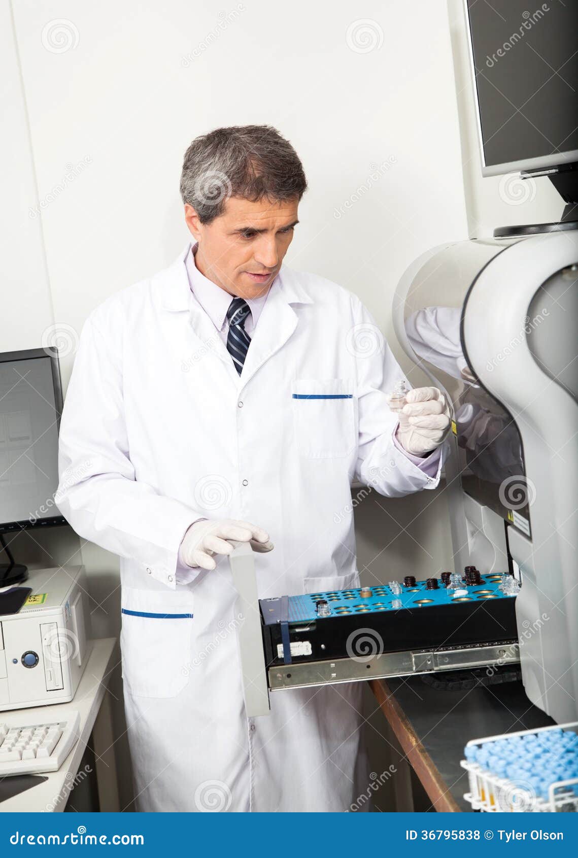 Scientist Loading Analyzer with Samples Stock Photo - Image of research ...