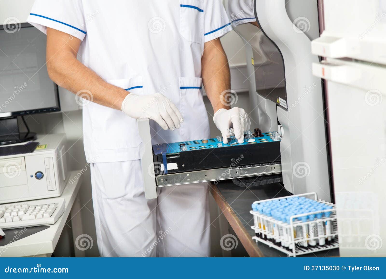 Scientist Loading Samples into Analyzer Stock Photo - Image of monitor ...