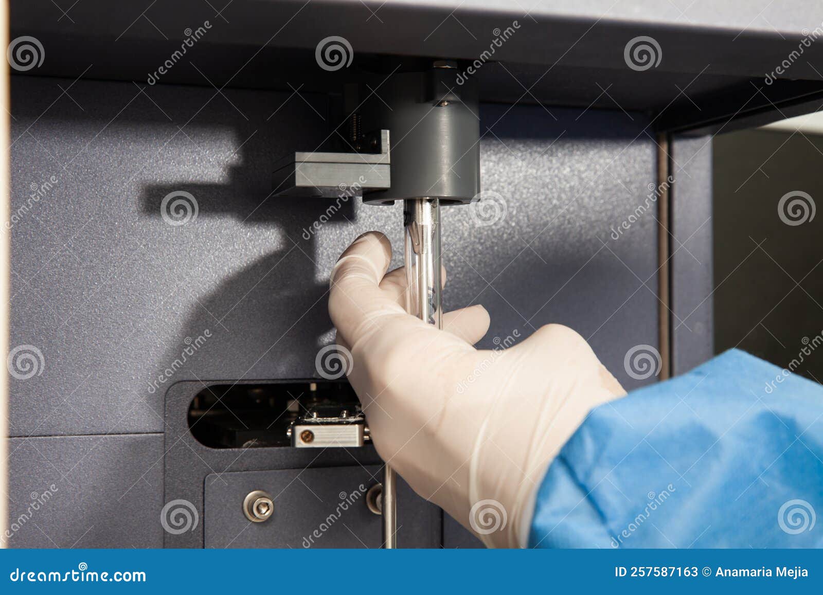 Scientist Loading a Test Tube Containing a Patient Sample on the Flow ...