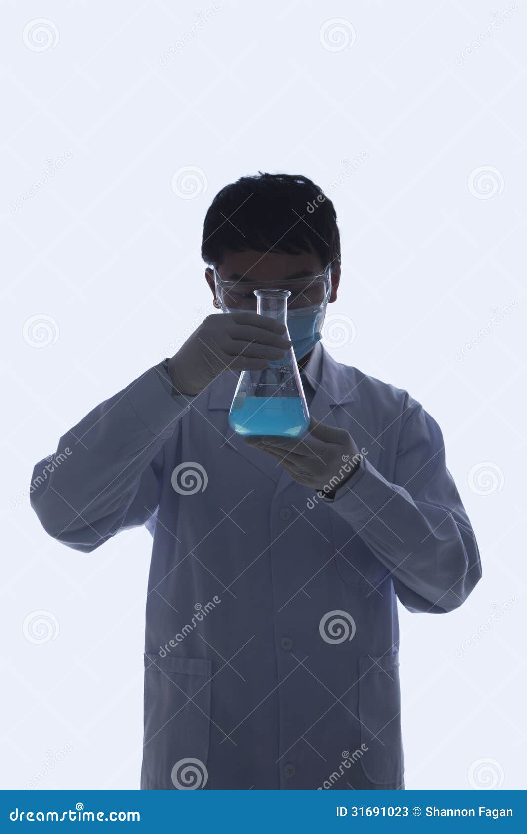 Scientist Looking at Beaker Stock Image - Image of mask, looking: 31691023