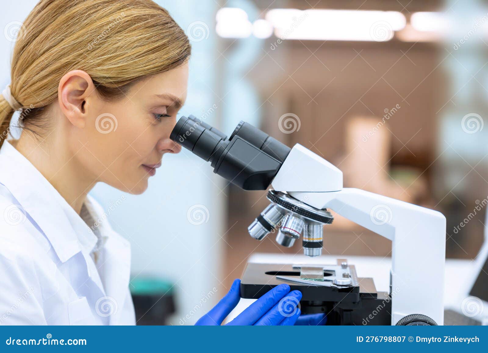 Scientist Looking Biochemical Cell in Laboratory Using Microscope ...