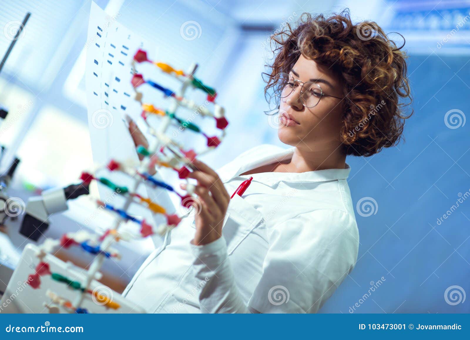 Scientist looking at DNA stock image. Image of fingerprint - 103473001