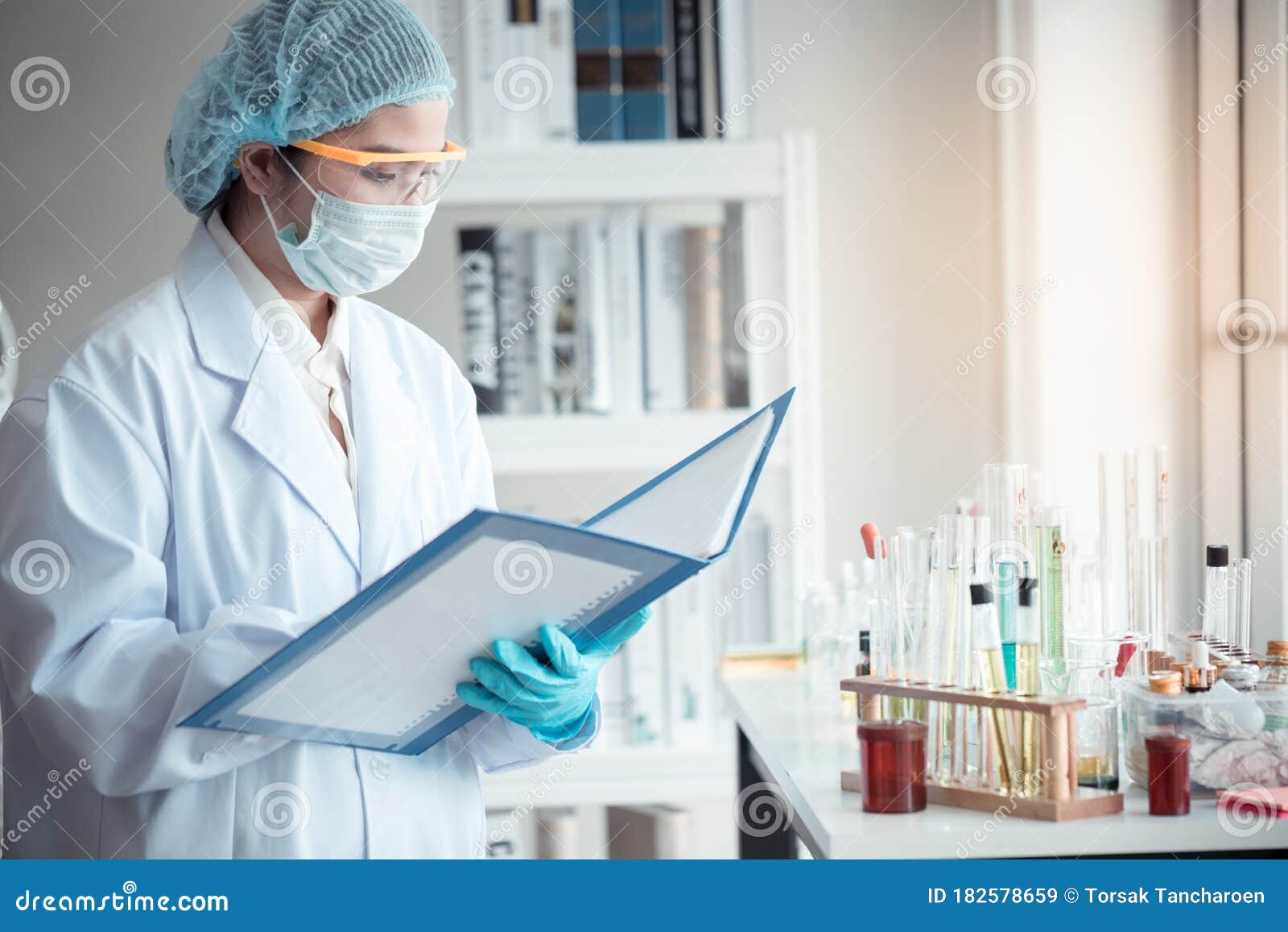 Scientist Looking through Folder Analsyt in Laboratory Stock Image ...