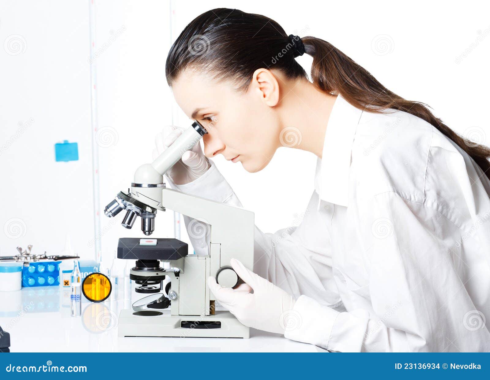 Scientist Looking through a Microscope Stock Photo - Image of ...