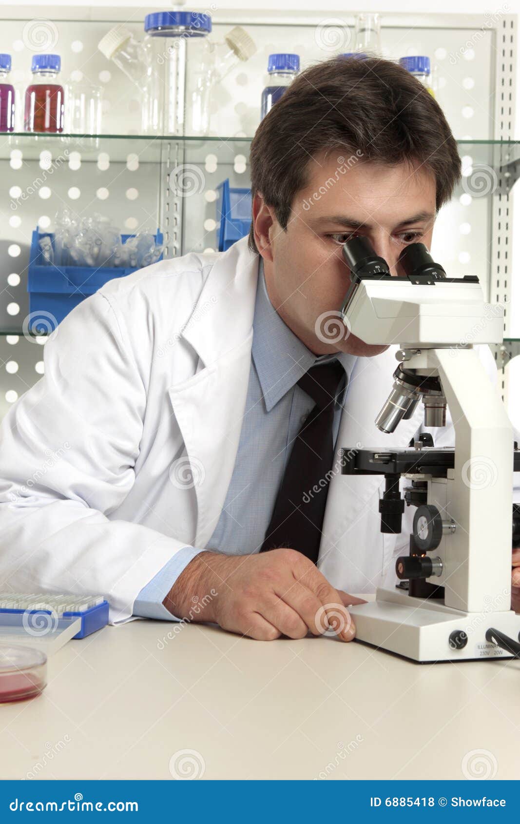 Scientist Looking through Microscope Stock Photo - Image of optical ...