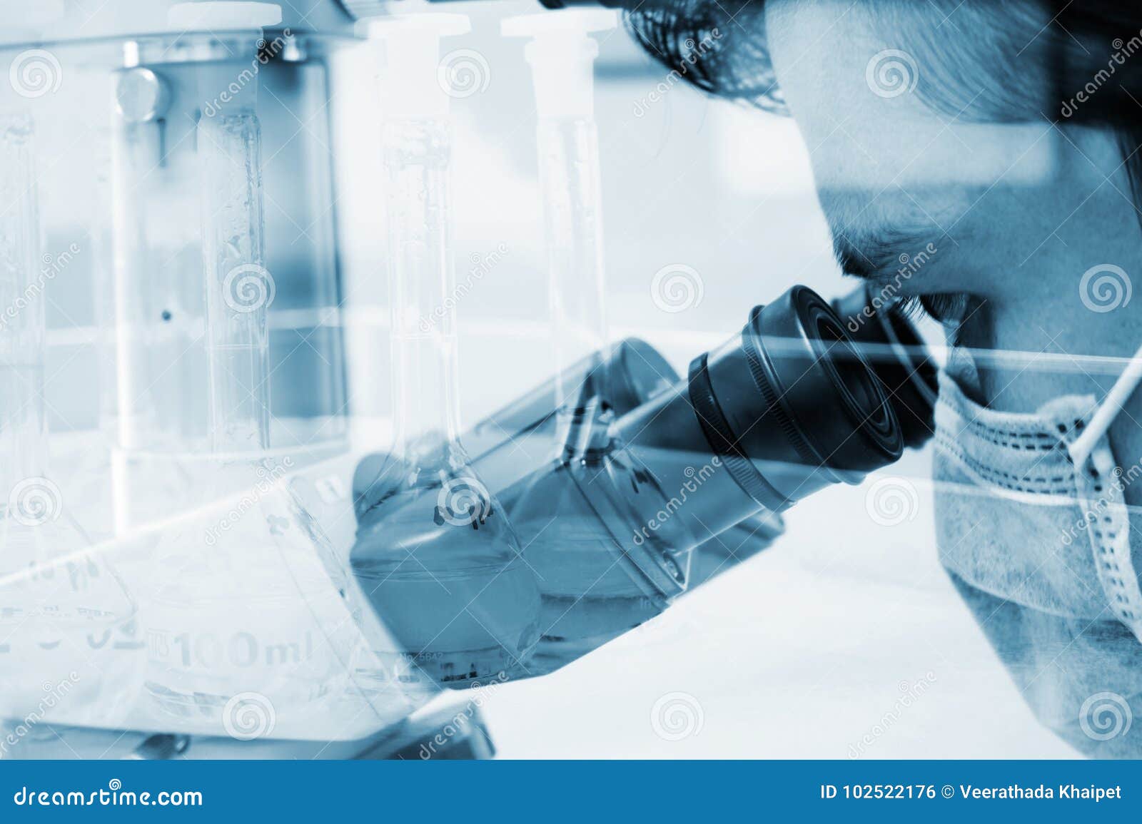 Scientist Looking through a Microscope for Chemistry Test Samples Stock ...