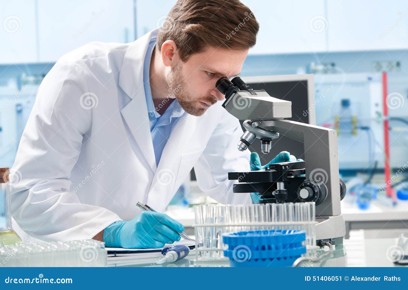 Scientist Looking through a Microscope Stock Image - Image of ...