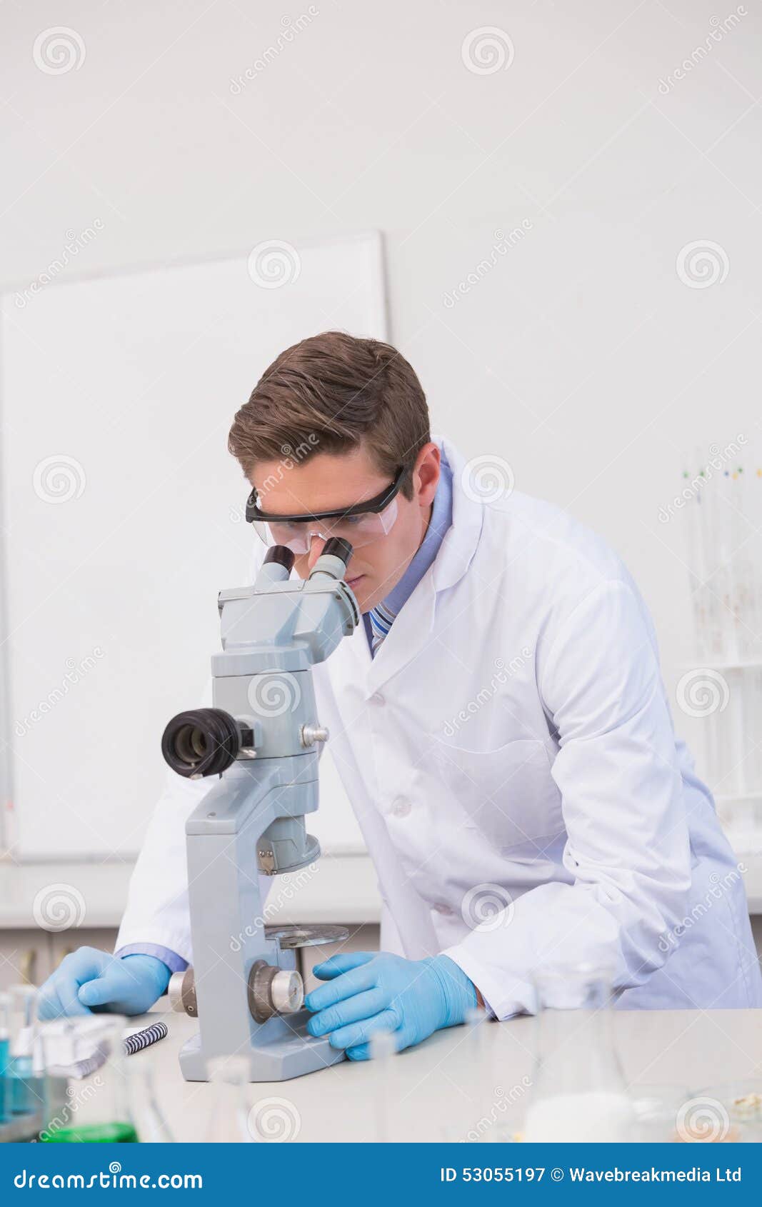 Scientist Looking through a Microscope Stock Image - Image of holding ...