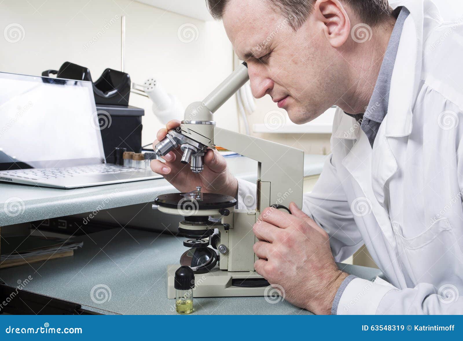 Scientist Looking through Microscope in Laboratory Stock Image - Image ...