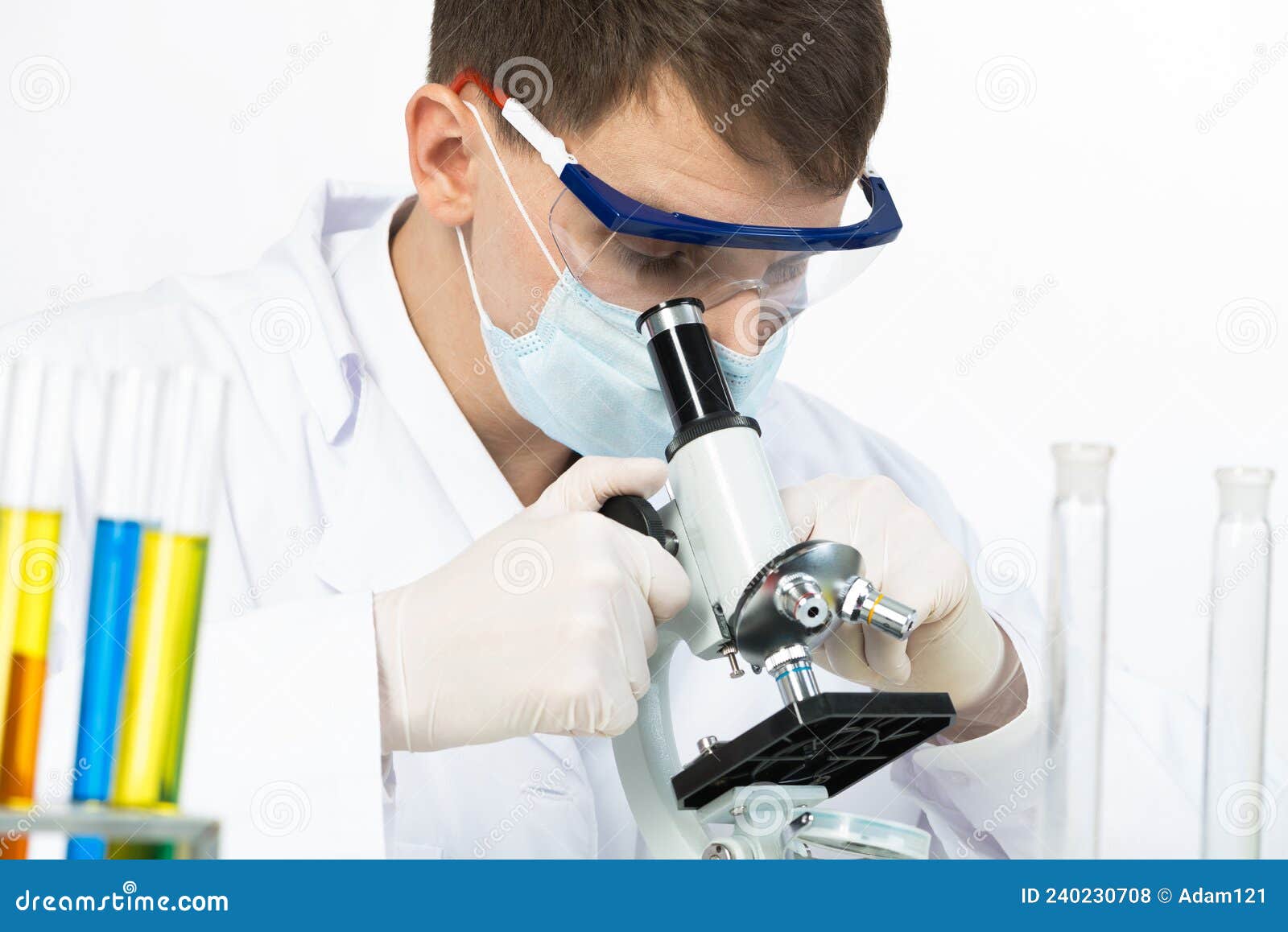 Scientist Looking through Microscope in Laboratory Stock Photo - Image ...