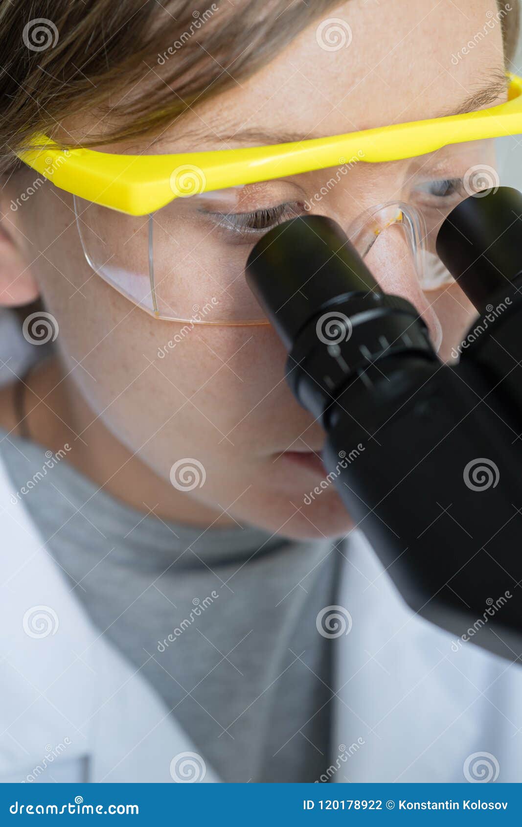Scientist Looking through a Microscope Stock Photo - Image of ...
