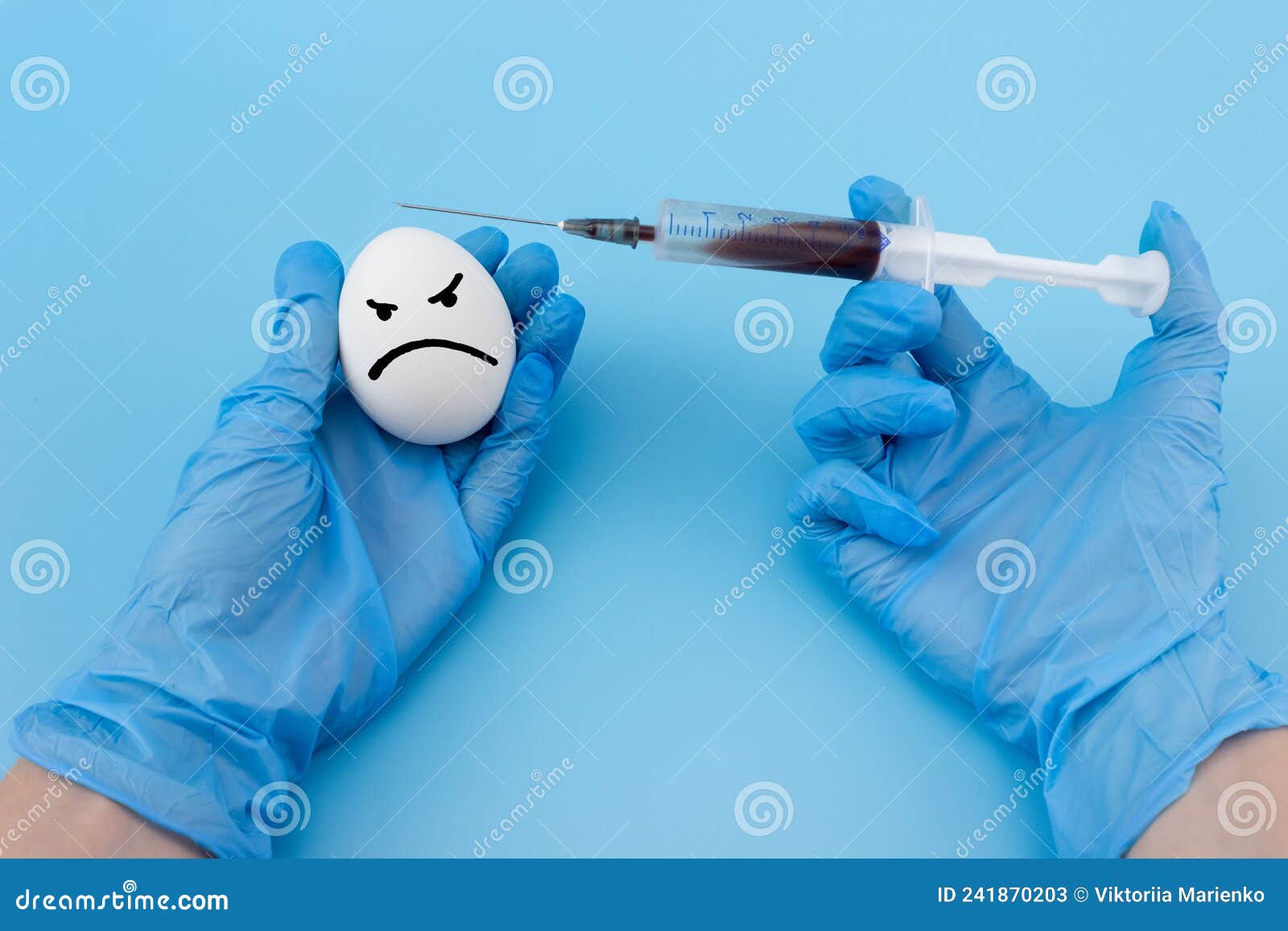 The Scientist Makes an Injection with a Syringe into the Egg Stock ...