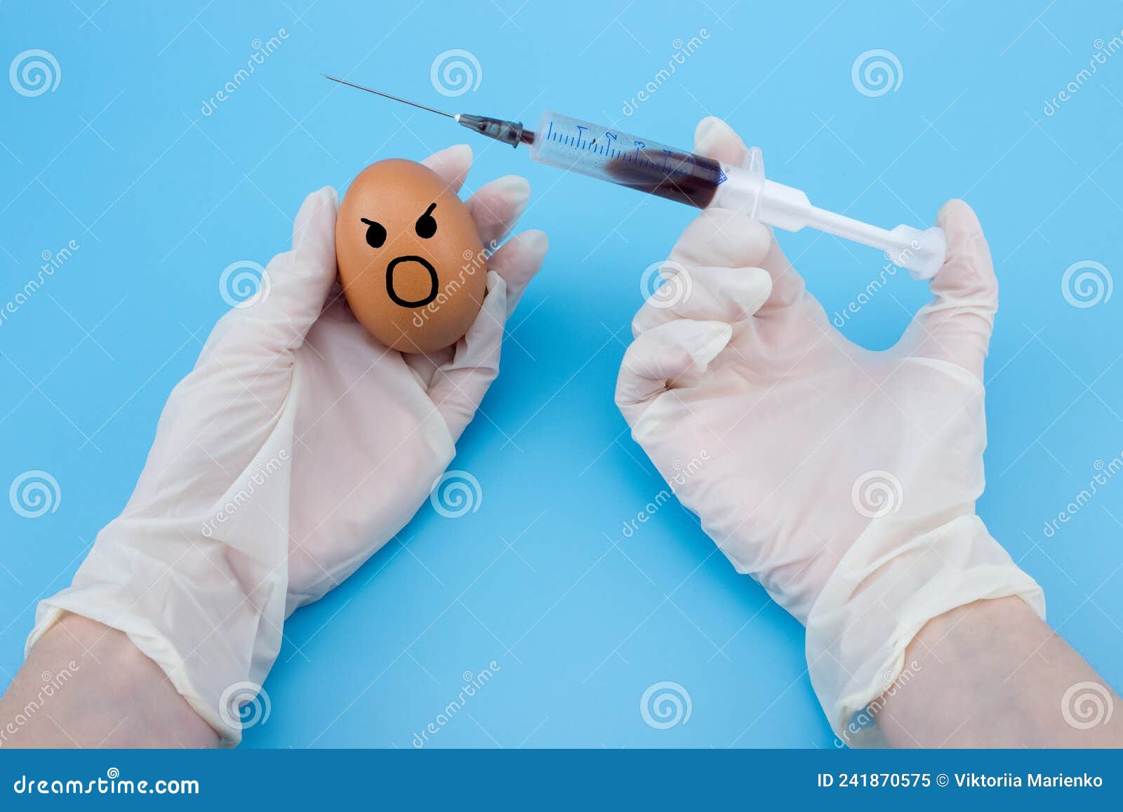 The Scientist Makes an Injection with a Syringe into the Egg Stock ...