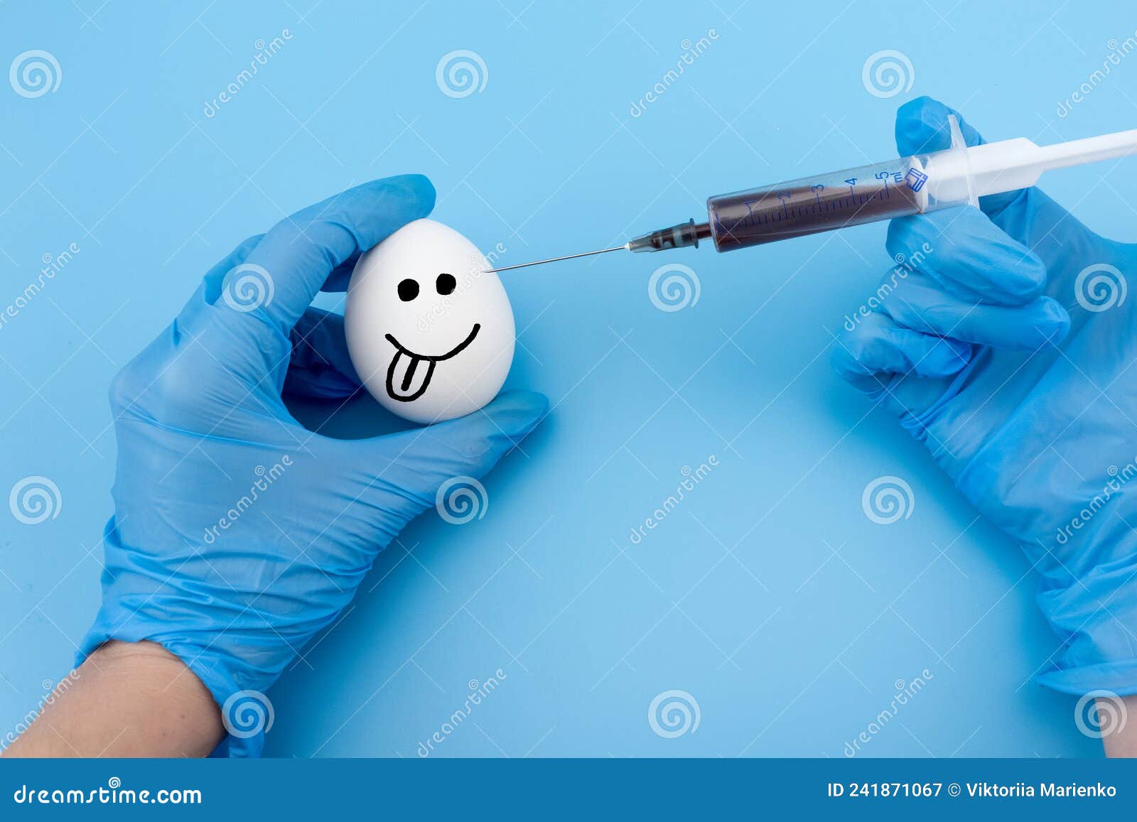 The Scientist Makes an Injection with a Syringe into the Egg Stock ...