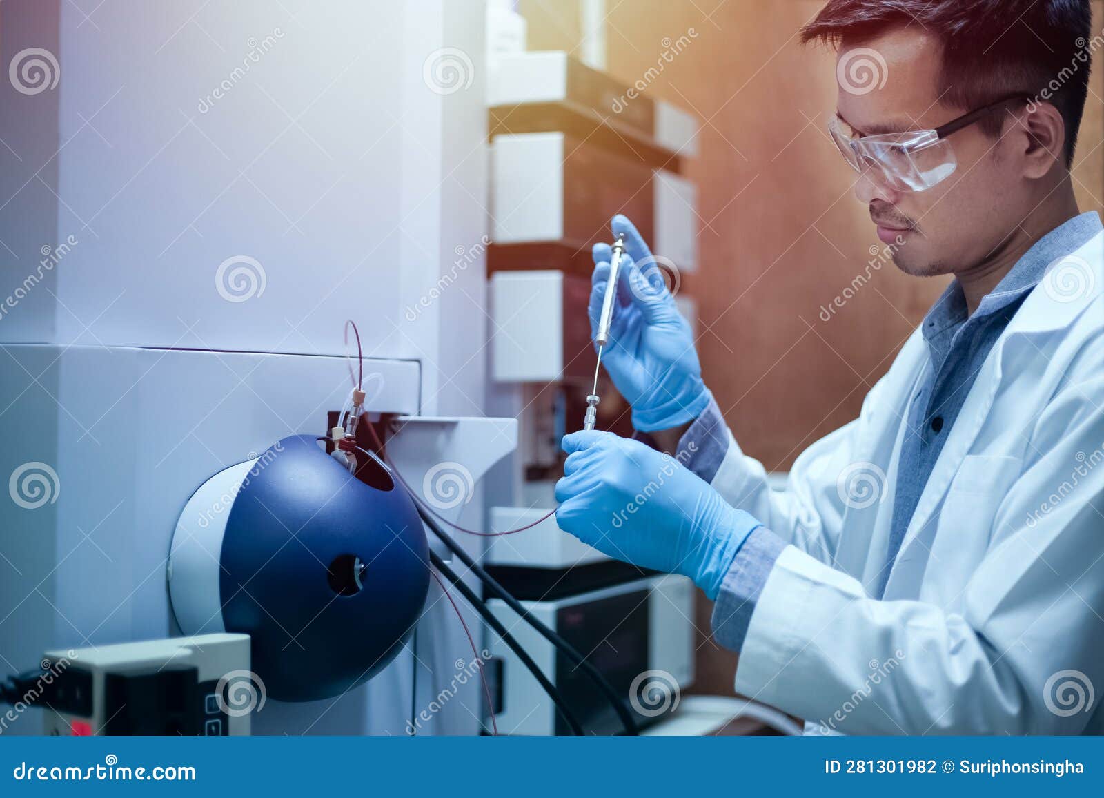 Scientist Man Analyzing a Sample Using the High-performance Analytical ...