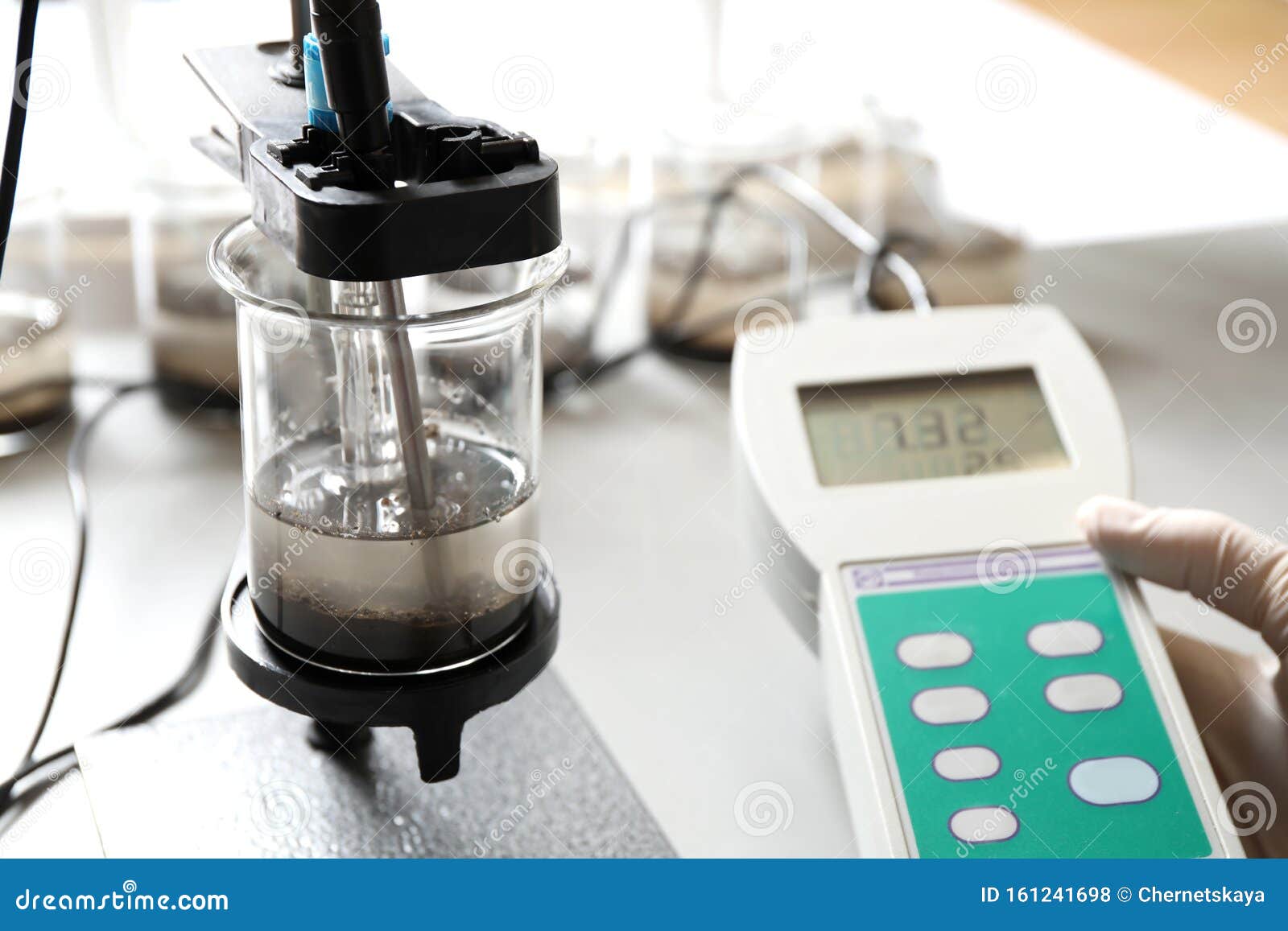 Scientist Measuring Acidity and PH of Soil at Table. Laboratory ...