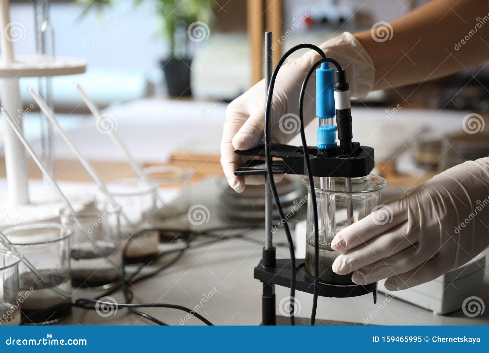 Scientist Measuring Acidity and PH of Soil at Table. Laboratory ...