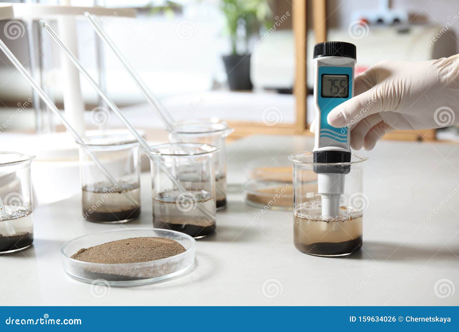 Scientist Measuring Acidity and PH of Soil at Table. Laboratory ...