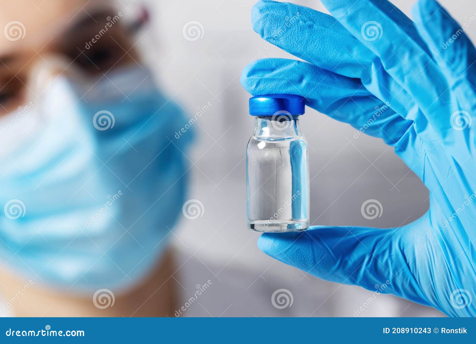 Scientist Medical Worker with Blank Vaccine Vial in Hand. New Product ... Scientist Medical Worker with Blank Vaccine Vial in Hand. New Product ...