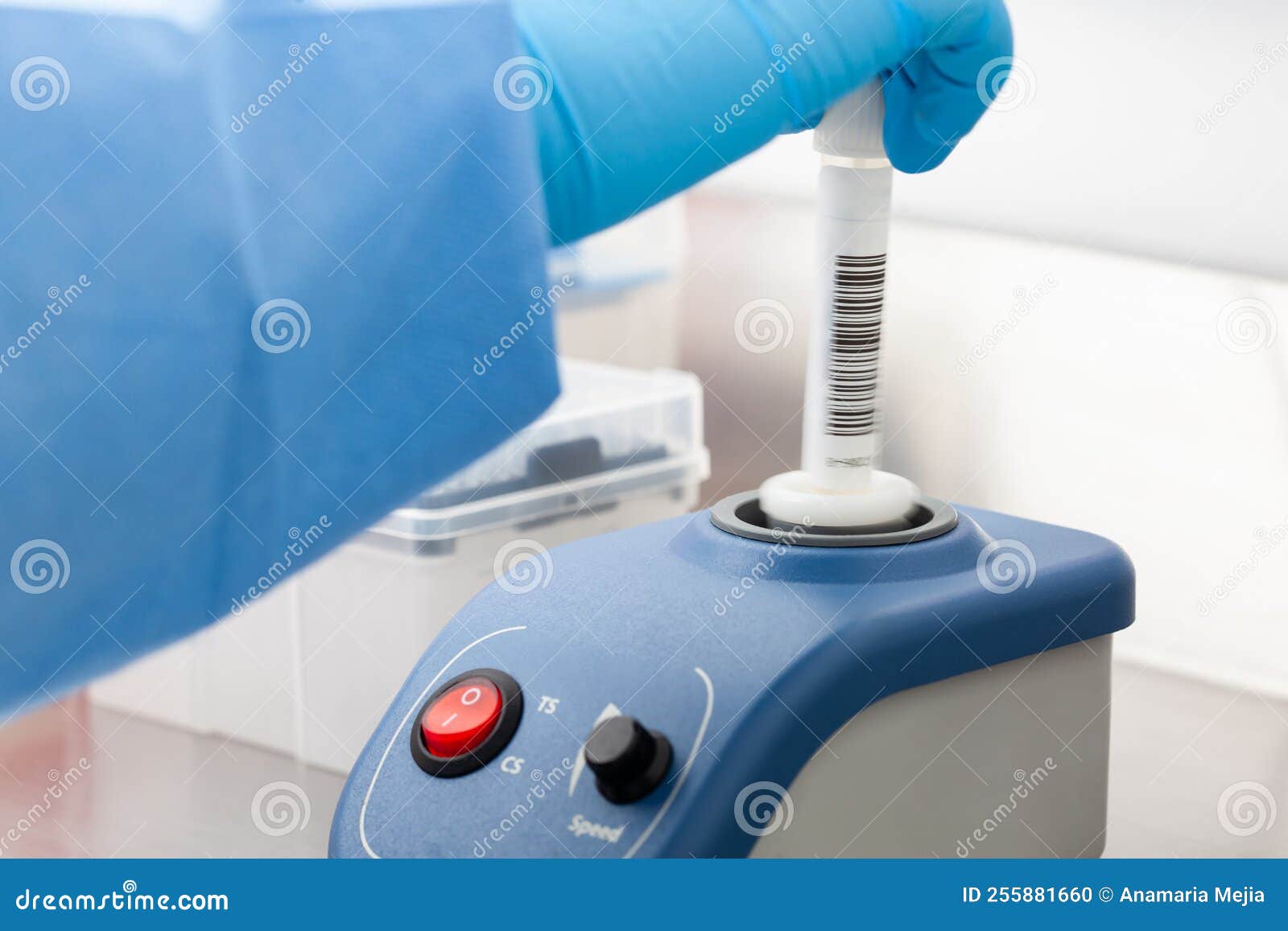 Scientist Mixes a Biological Sample for Analysis Using a Lab Vortex ...
