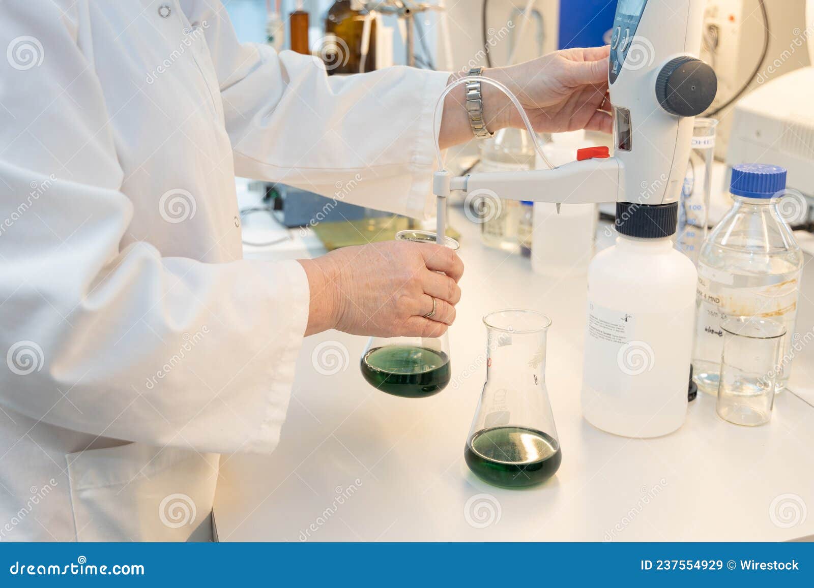 Scientist Mixing Liquids at the Lab Stock Image - Image of glove ...