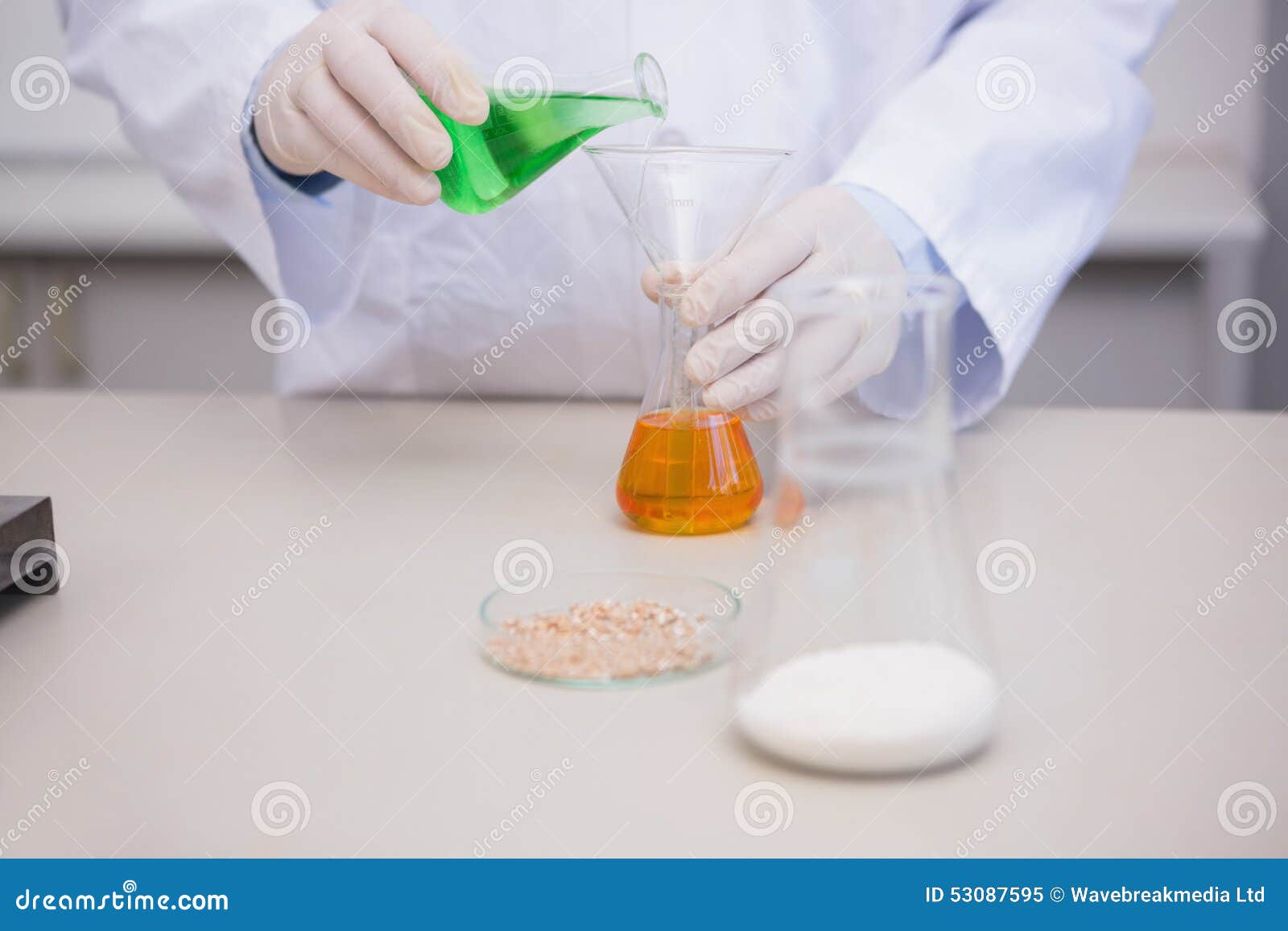 Scientist Mixing Test Liquid In Tube Looking At Reaction, Lab Rat ...