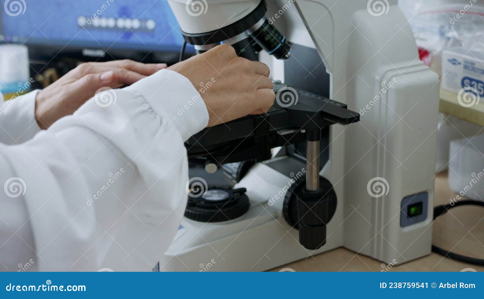 Scientist Placing Samples Under a Microscope for Inspection Stock Video ...