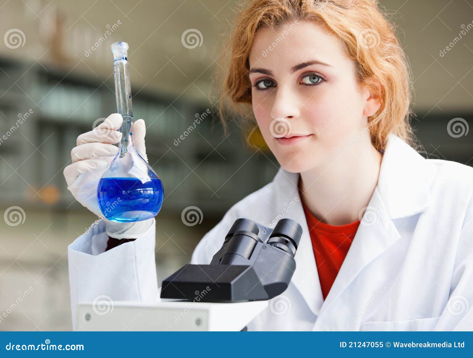 Scientist Posing with a Microscope and a Flask Stock Image - Image of ...
