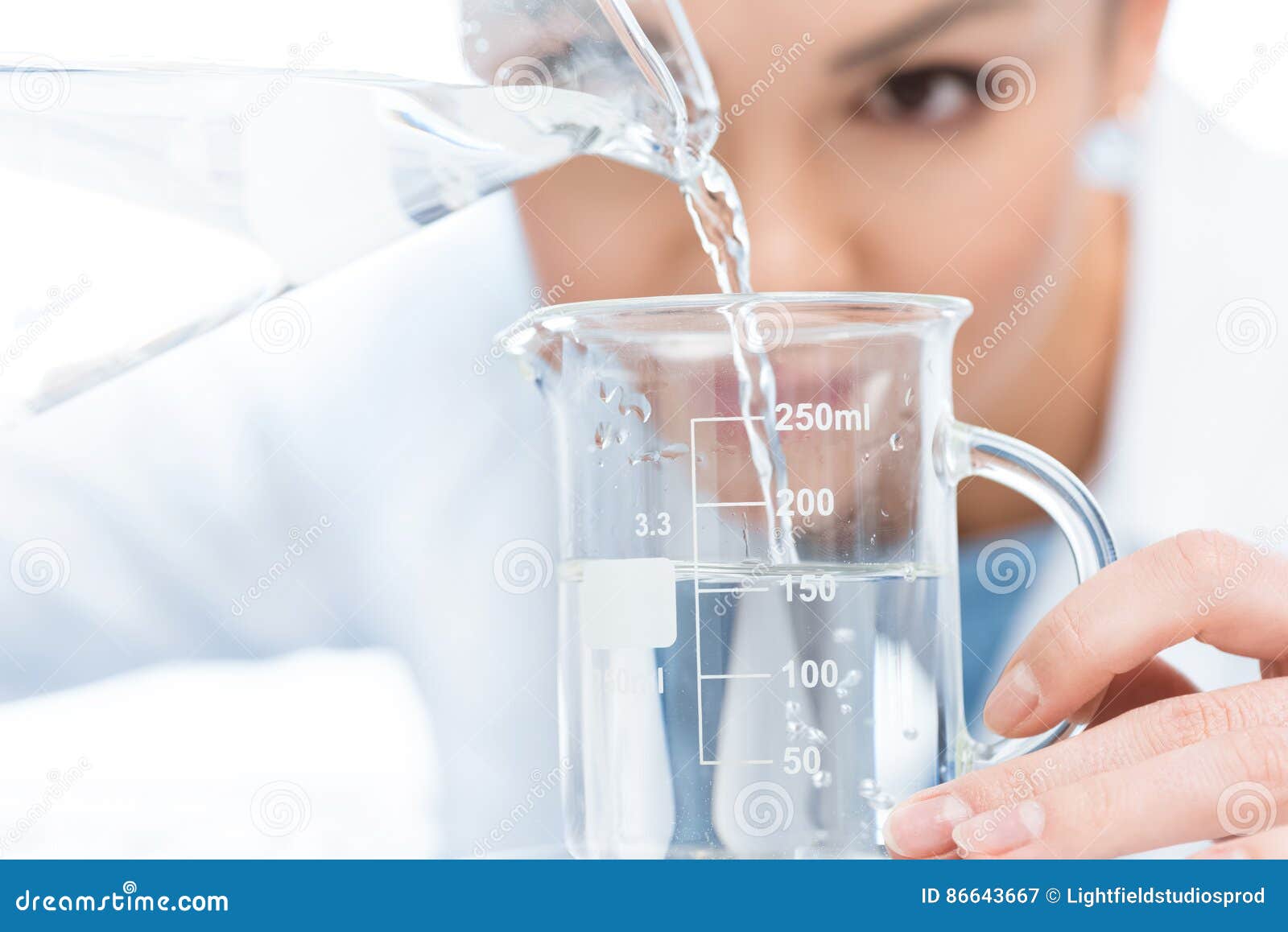 Scientist Pouring Chemical Liquid into Laboratory Glassware Stock Image ...