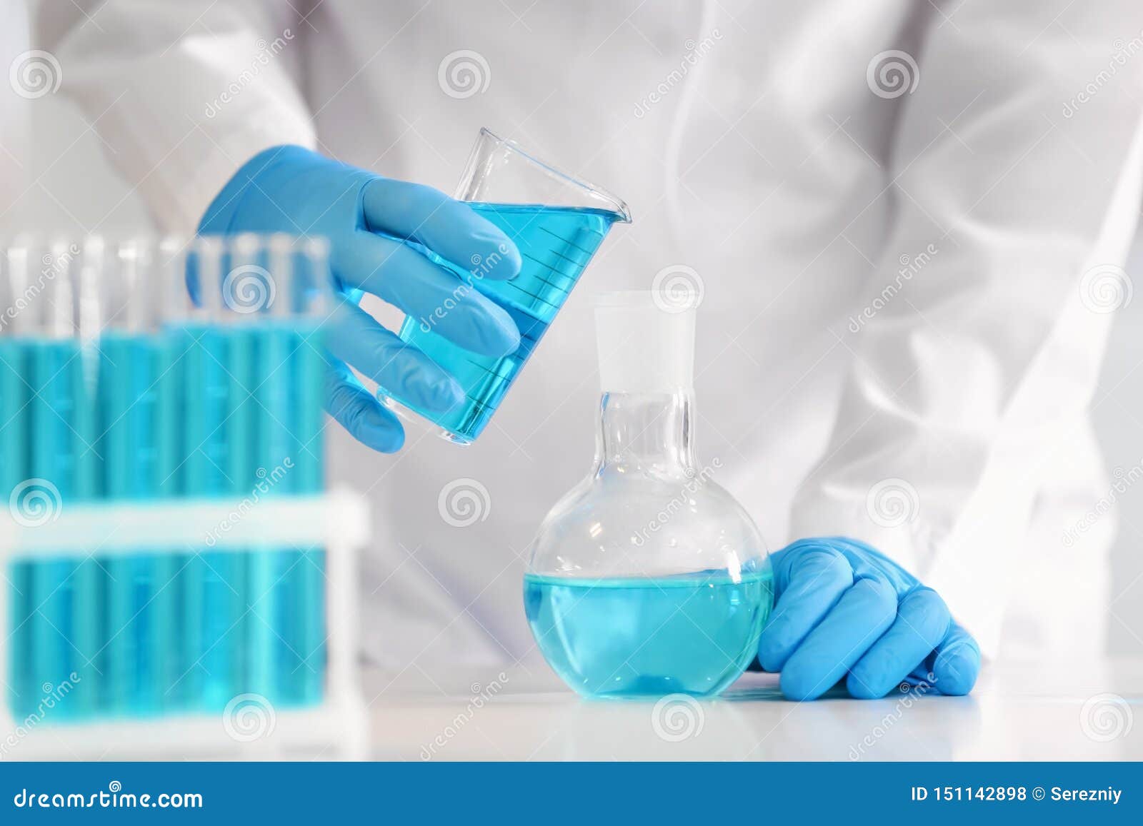 Scientist Pouring Color Liquid into Flask in Laboratory Stock Photo ...