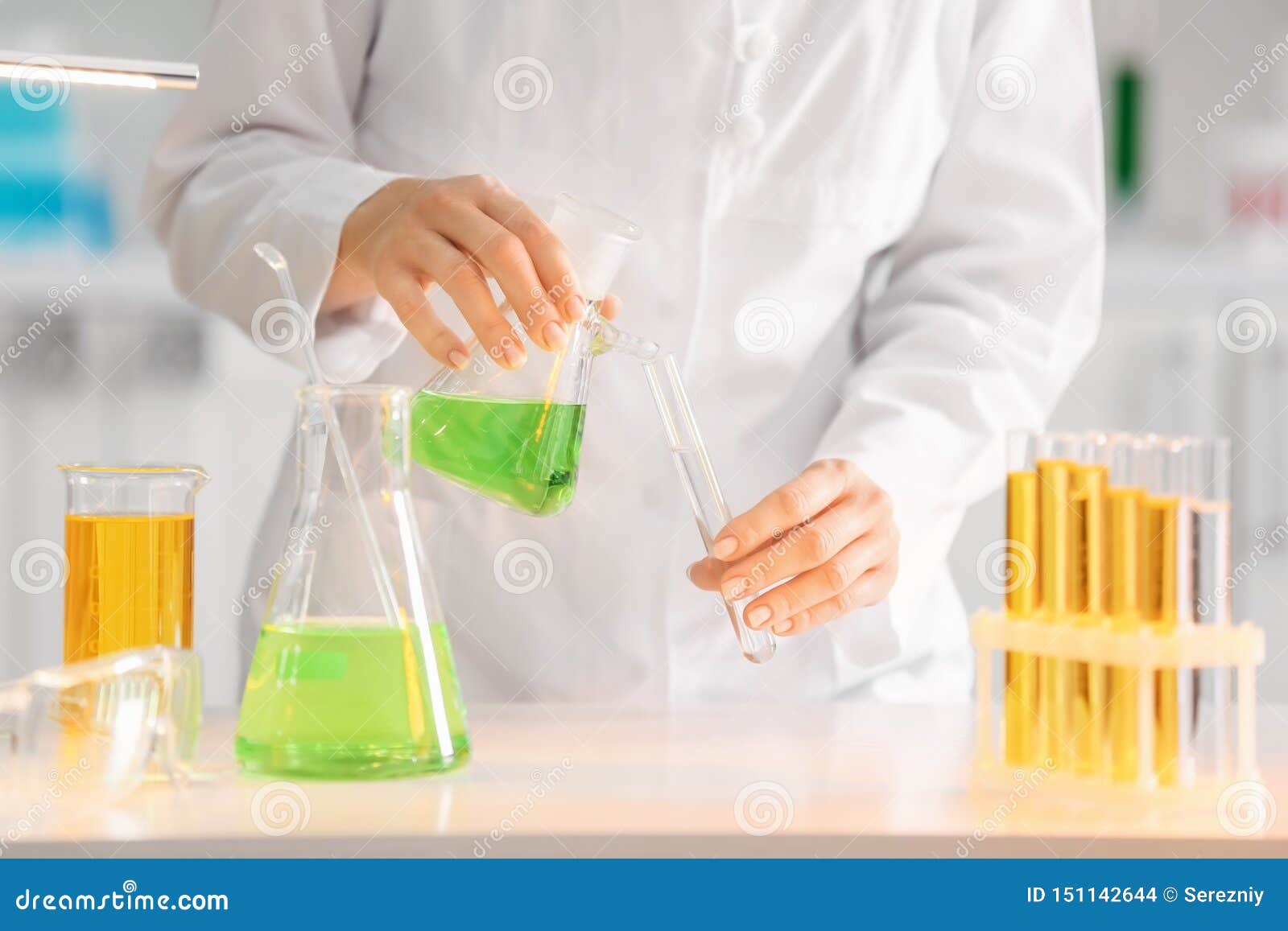 Scientist Pouring Color Liquid into Test Tube in Laboratory Stock Photo ... Scientist Pouring Color Liquid into Test Tube in Laboratory Stock Photo ...