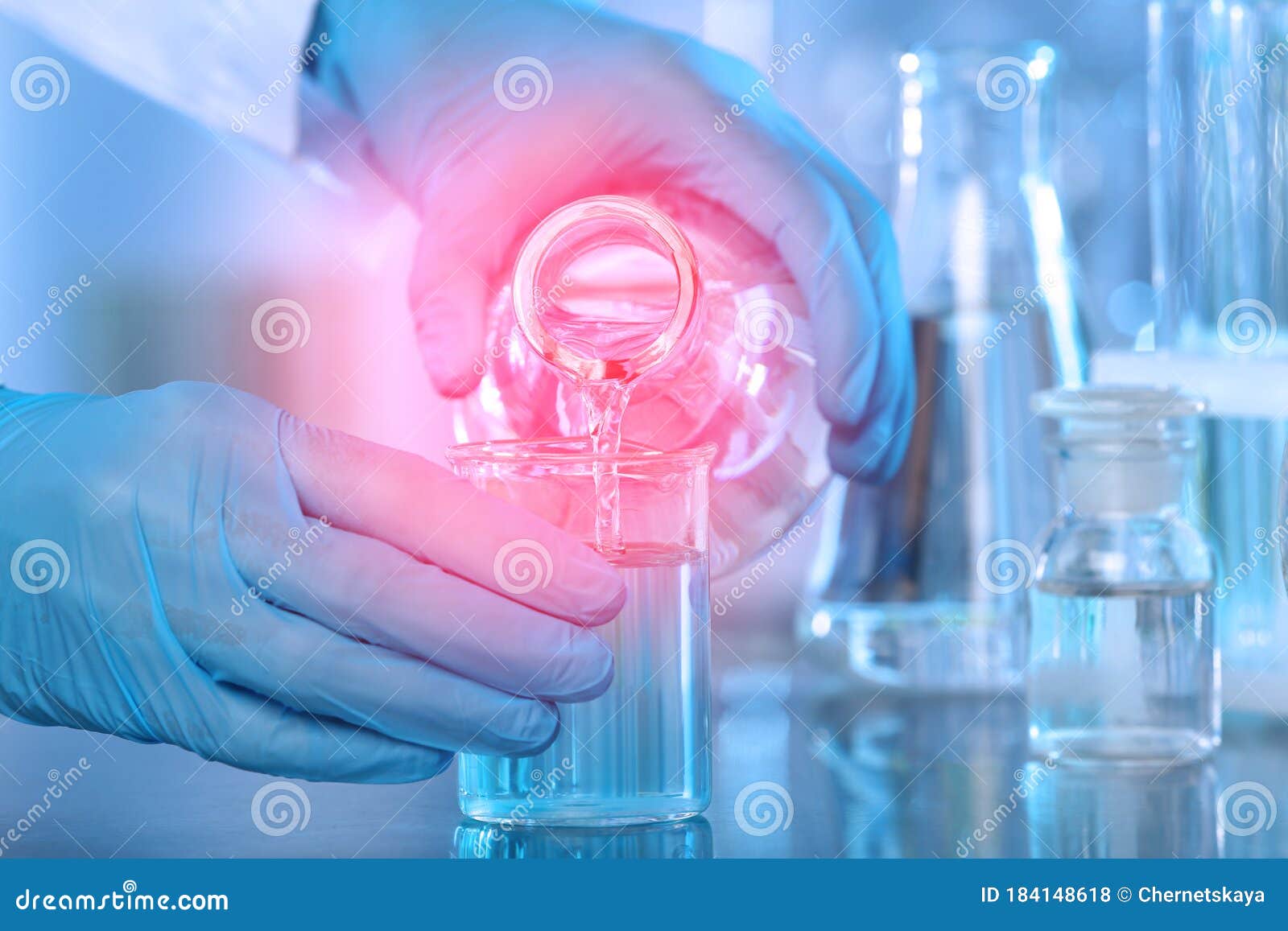 Scientist Pouring Liquid into Beaker at Table. Laboratory Analysis ...