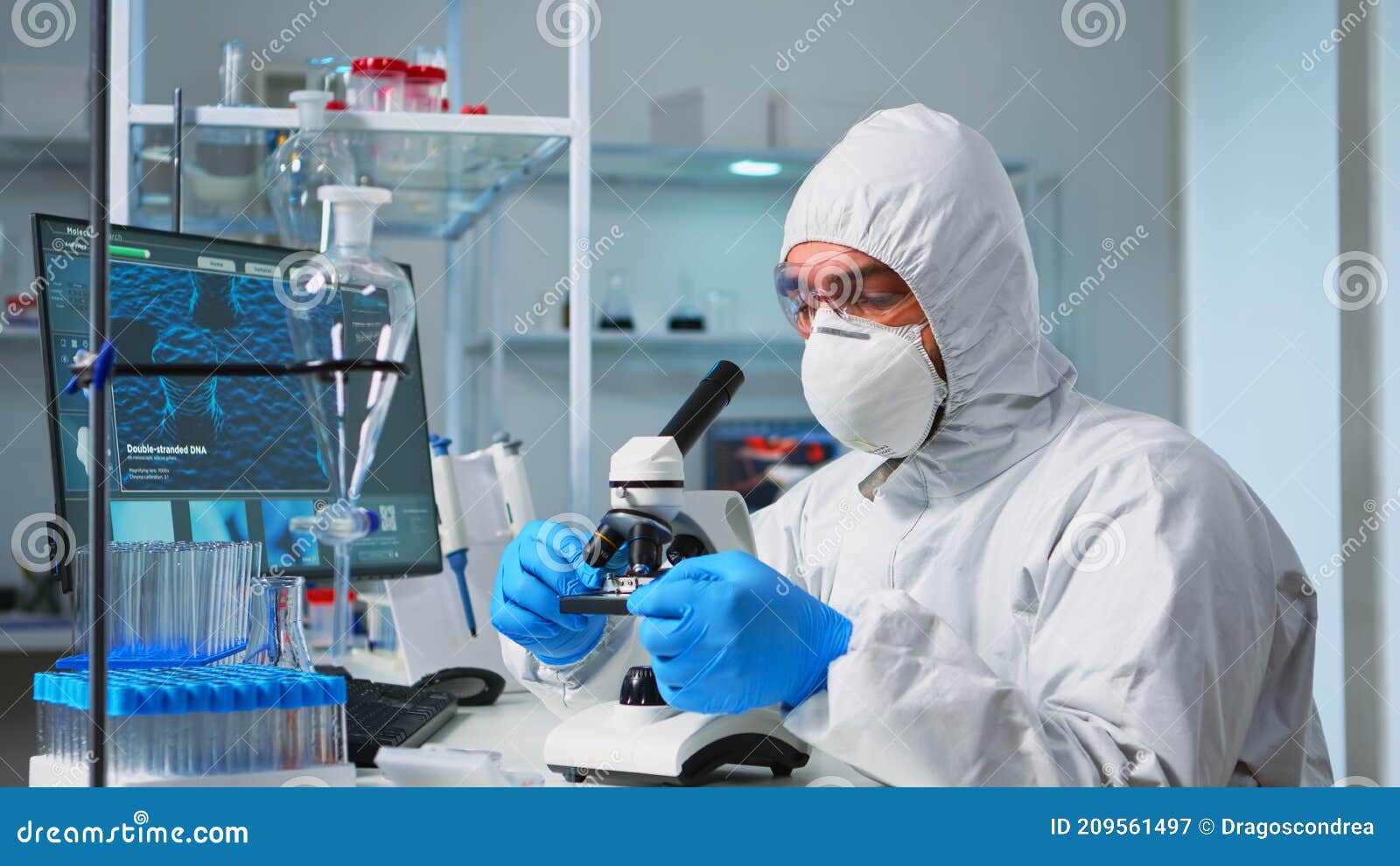 Scientist in Ppe Suit Placing a Slide on Specimen Stage Stock Image ...