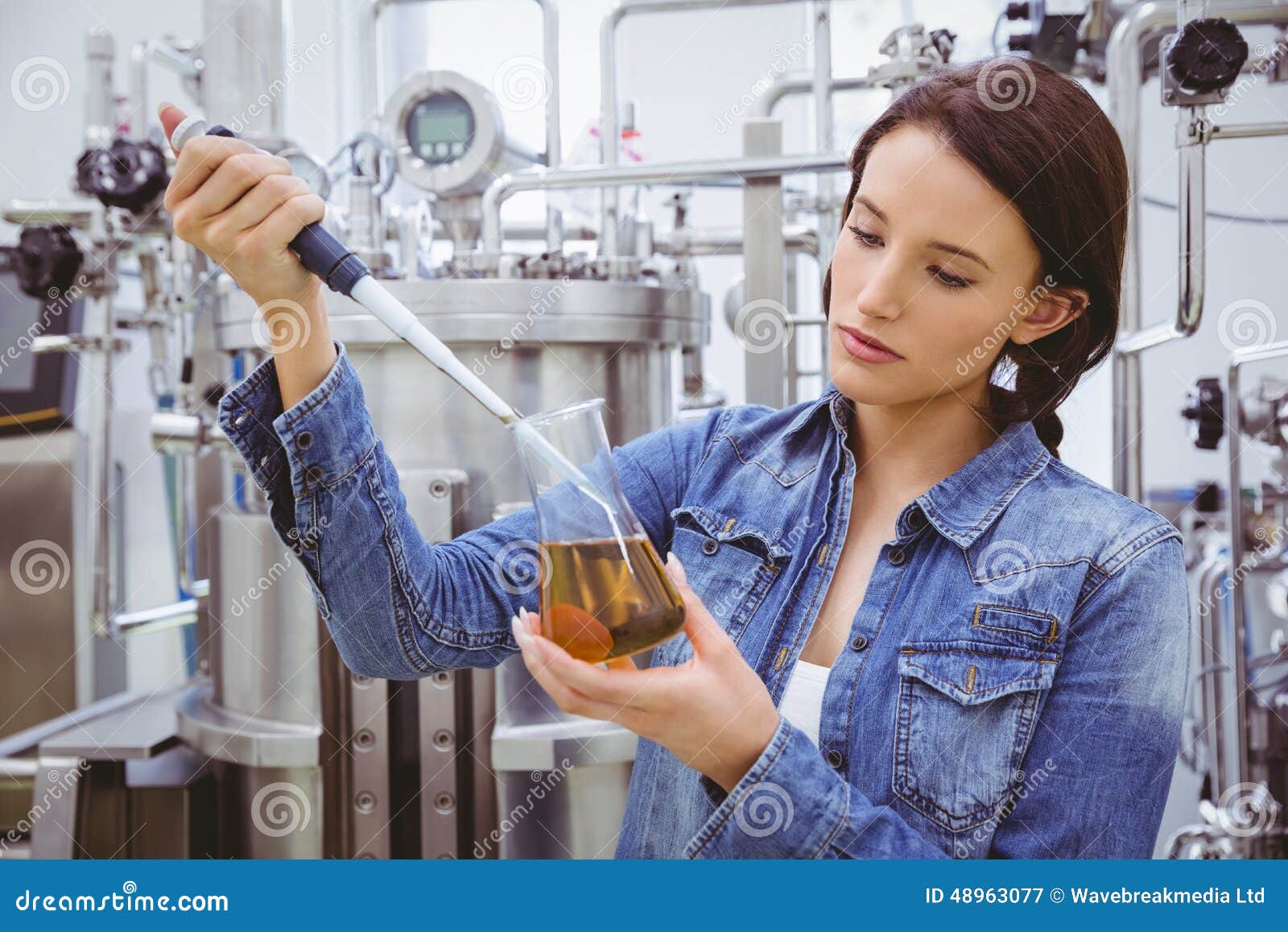 Scientist Preparing an Experiment with a Pipette and Beaker Stock Image ...