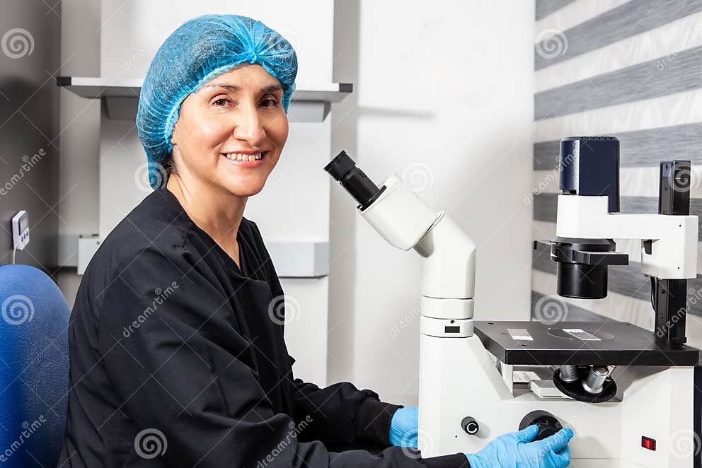 Scientist Preparing a Paraffin Embedded Tissue for Pathology Analysis. Floating Method for ...