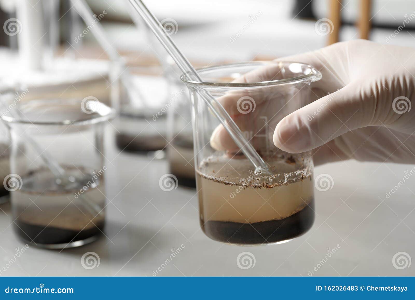 Scientist Preparing Soil Extract at Table. Laboratory Analysis Stock ...