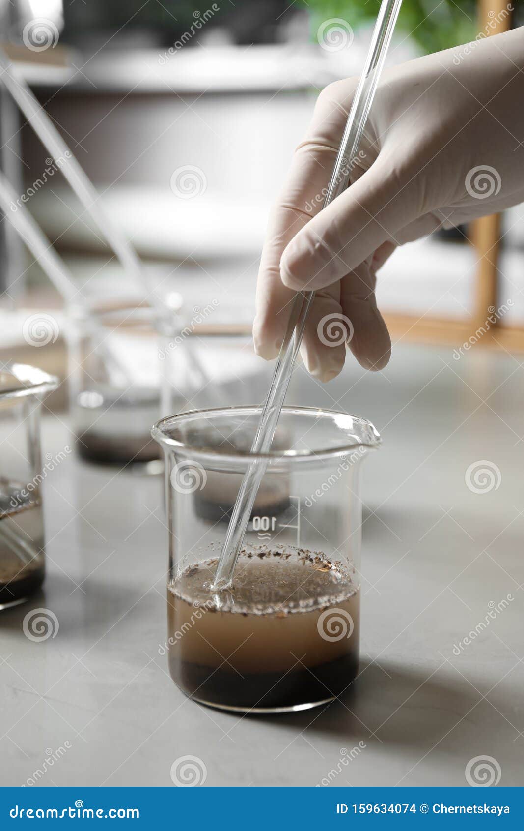 Scientist Preparing Soil Extract at Table. Laboratory Analysis Stock ...