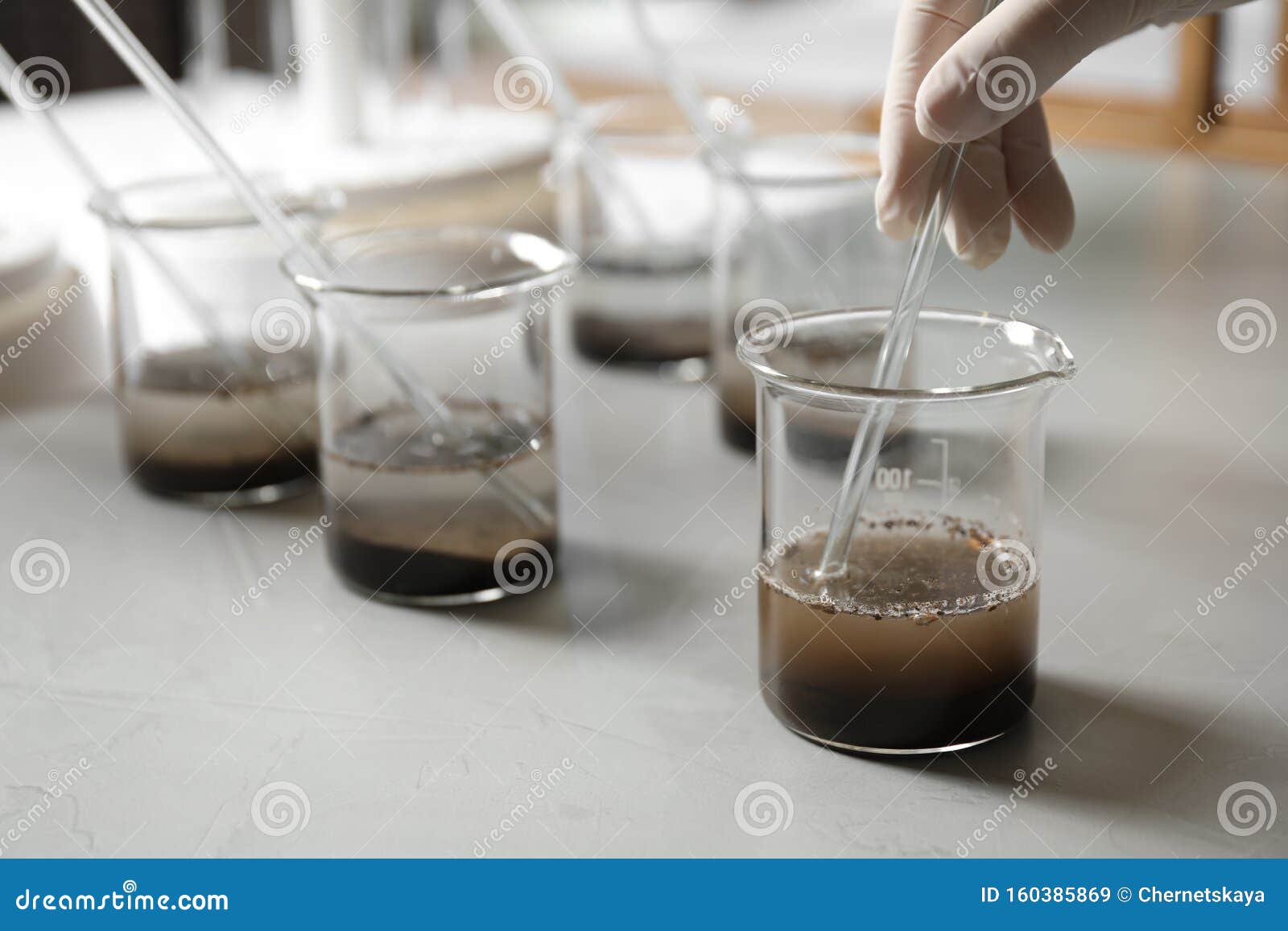 Scientist Preparing Soil Extract at Table. Laboratory Analysis Stock ...