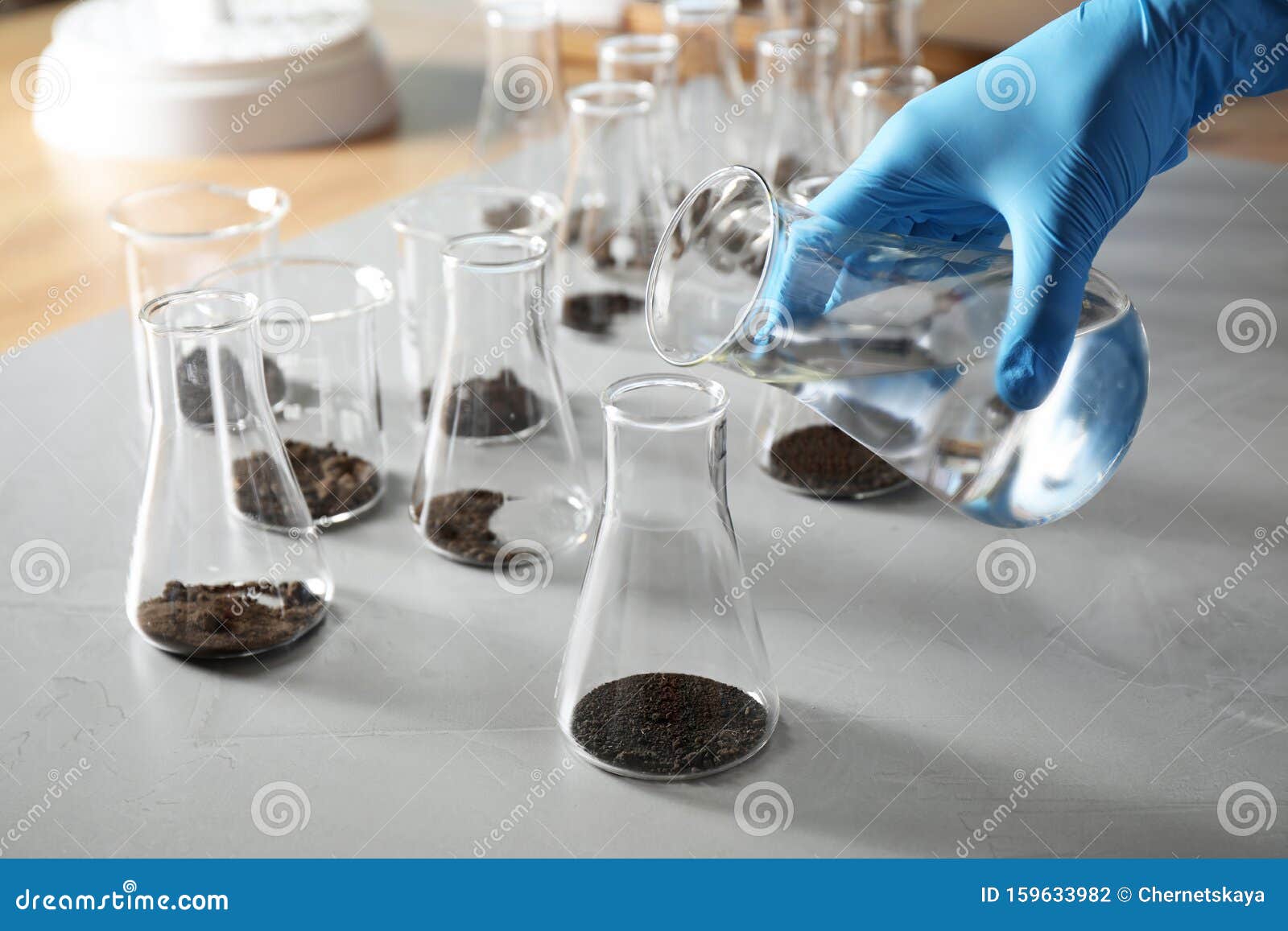 Scientist Preparing Soil Extract at Table. Laboratory Research Stock ...