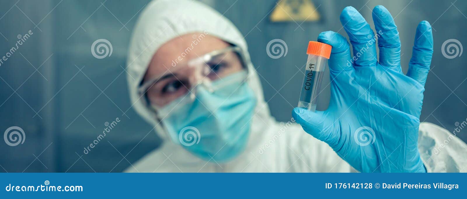 Scientist with Protection Suit Looking Vial in the Laboratory Stock ...