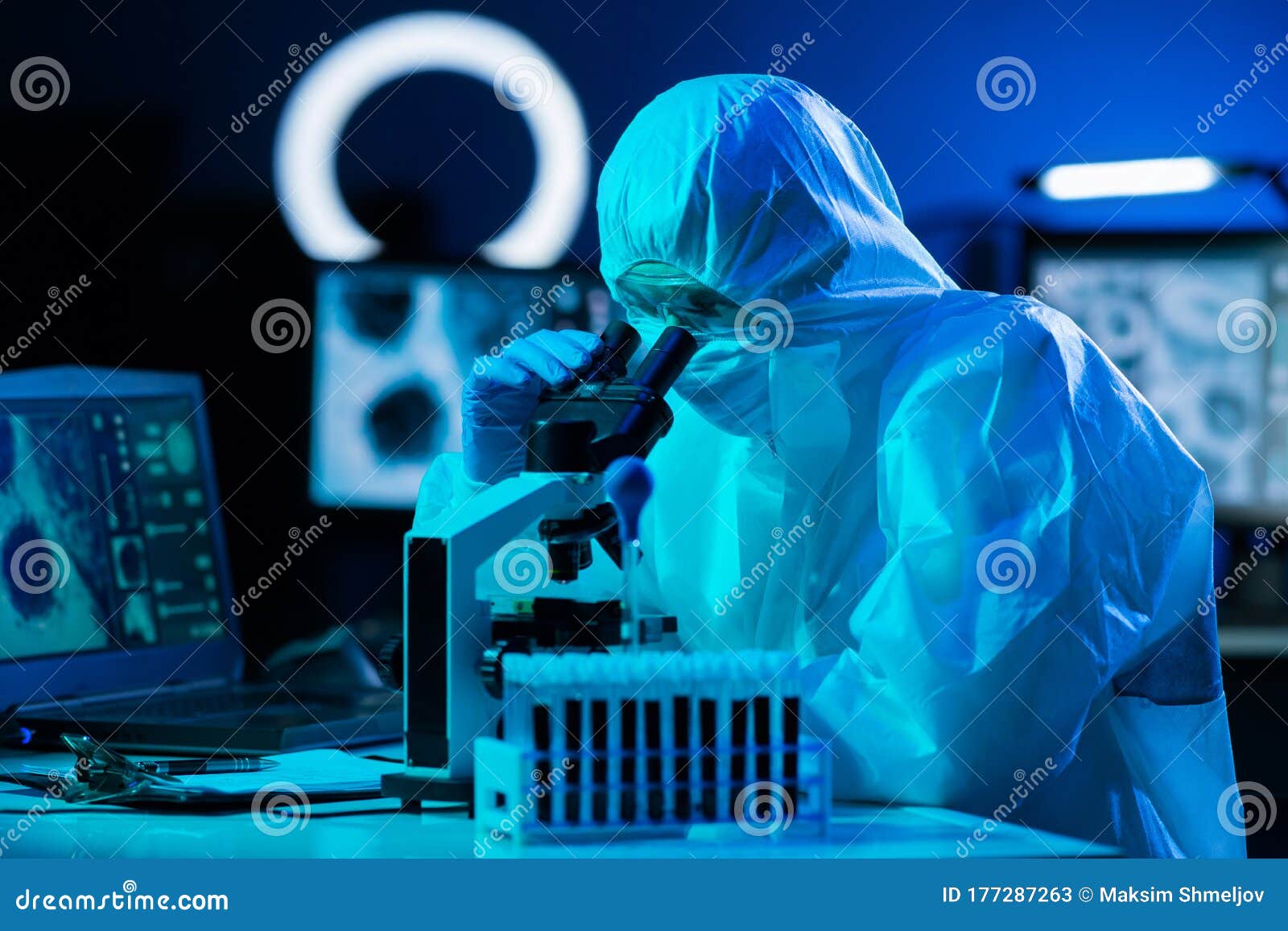Scientist in Protection Suits and Masks Working in Research Lab Using ...