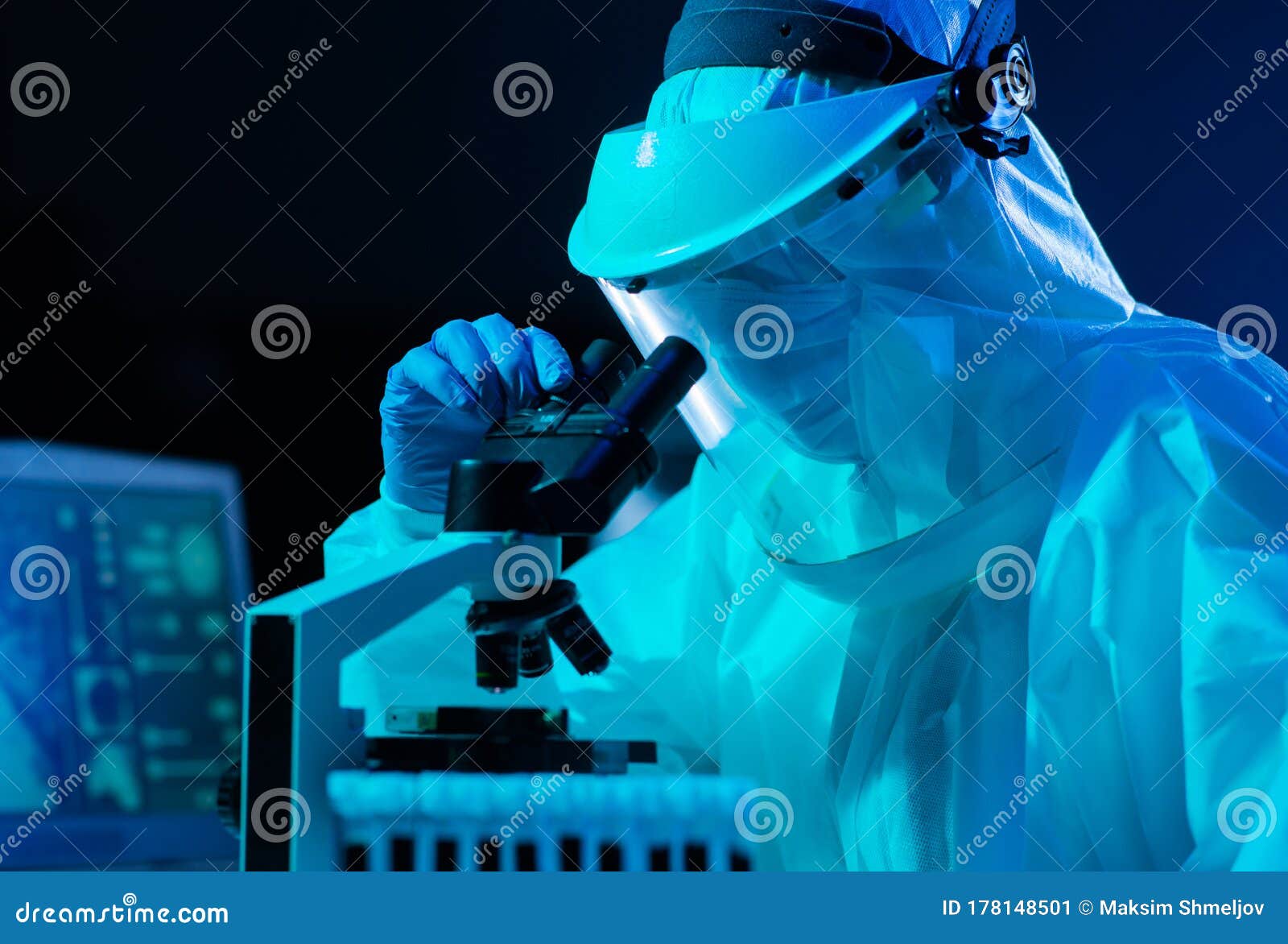 Scientist in Protection Suits and Masks Working in Research Lab Using ...