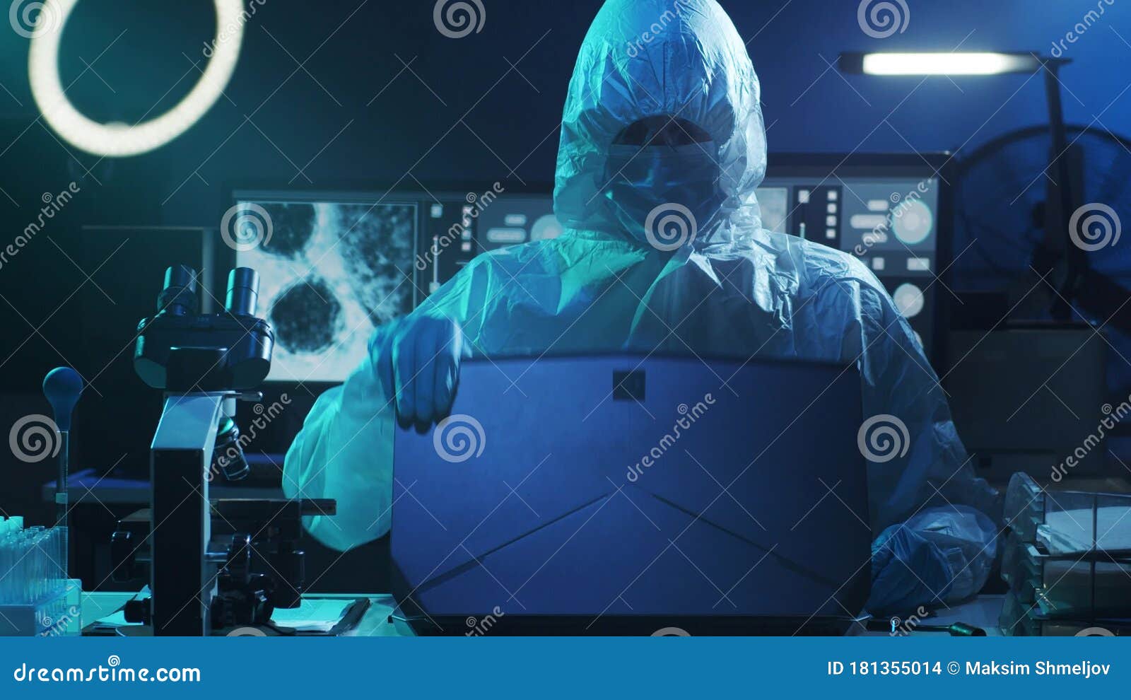 Scientist in Protection Suits and Masks Working in Research Lab Using ...