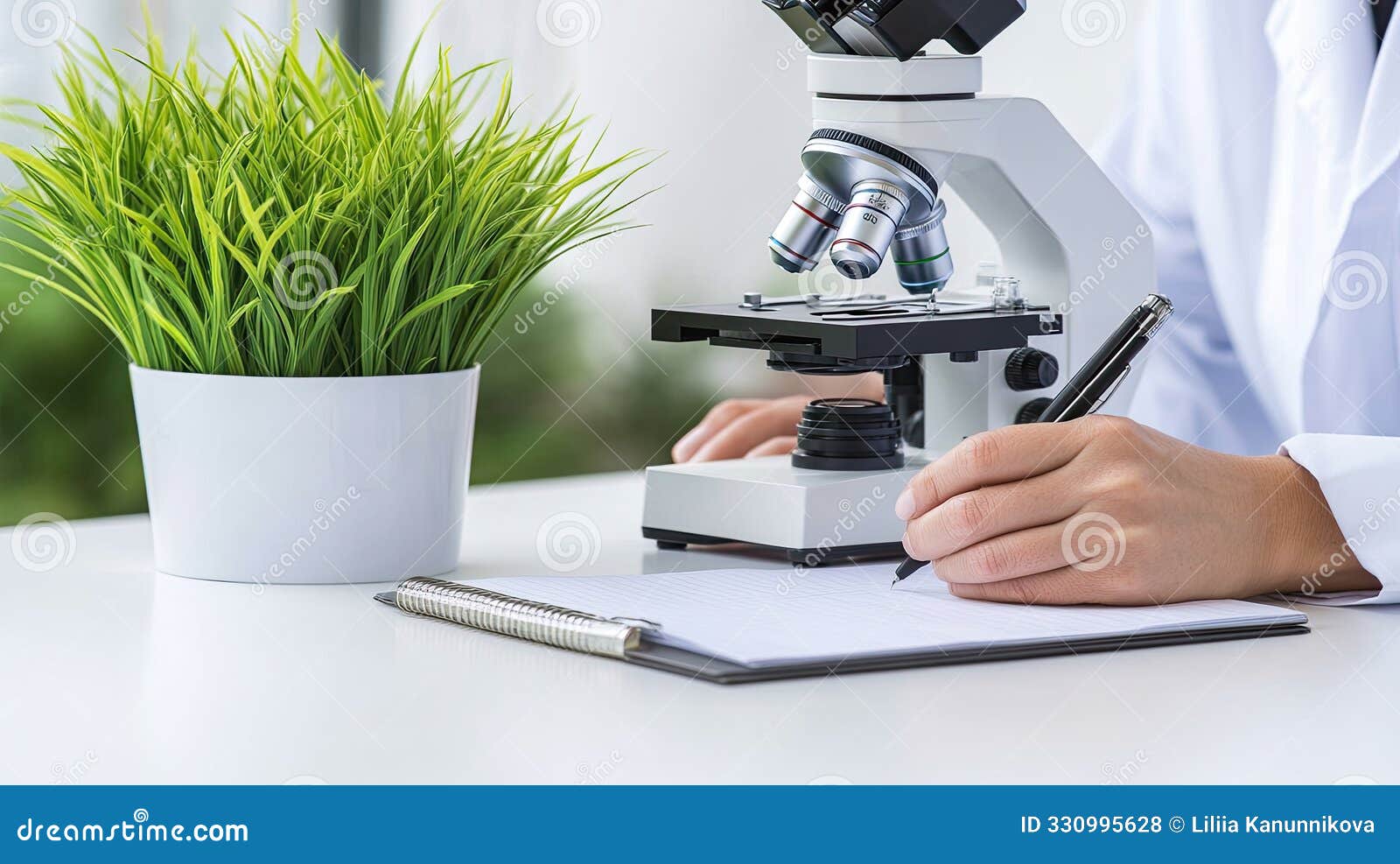 A Scientist in Protective Gear Carefully Examines a Test Tube Under a ...