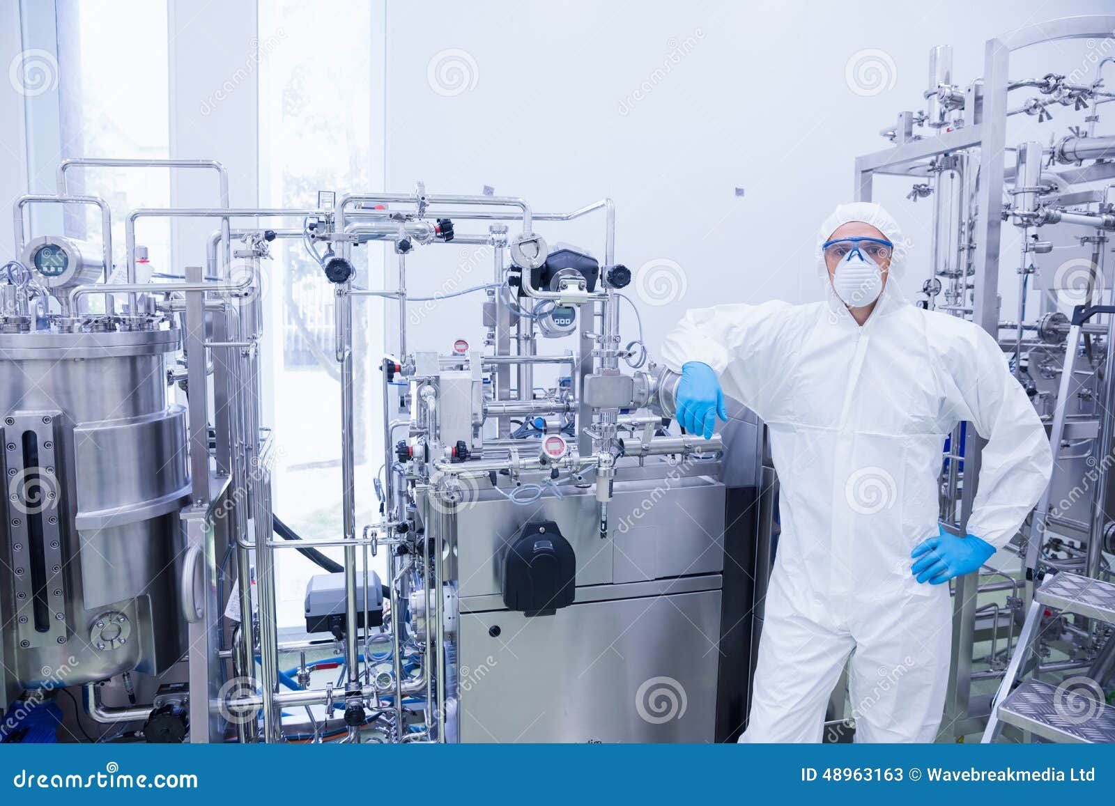 Scientist in Protective Suit Leaning Against Machine Stock Image ...