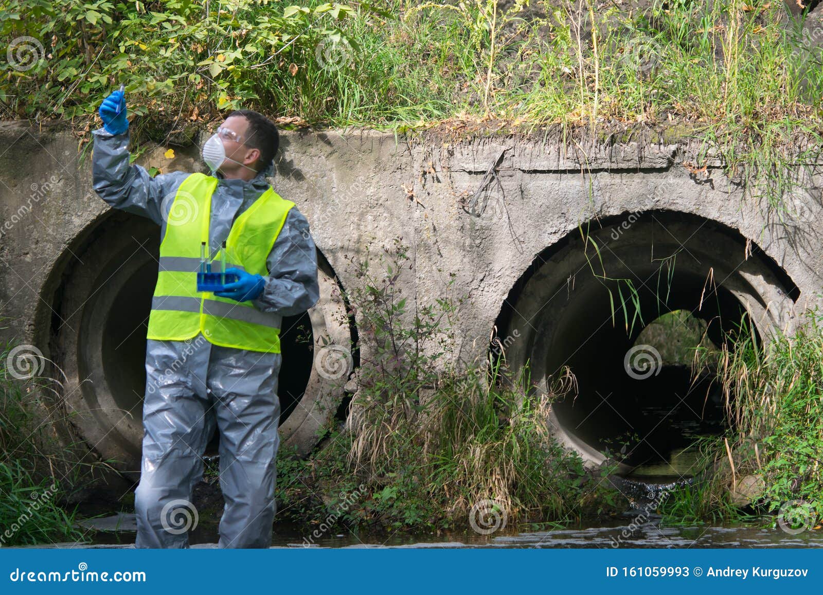 The Scientist, in a Protective Suit and Mask, on the Background of ...