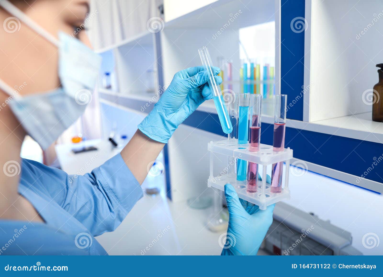 Scientist Putting Sample Compartment With Liquid In Spectrophotometer ...
