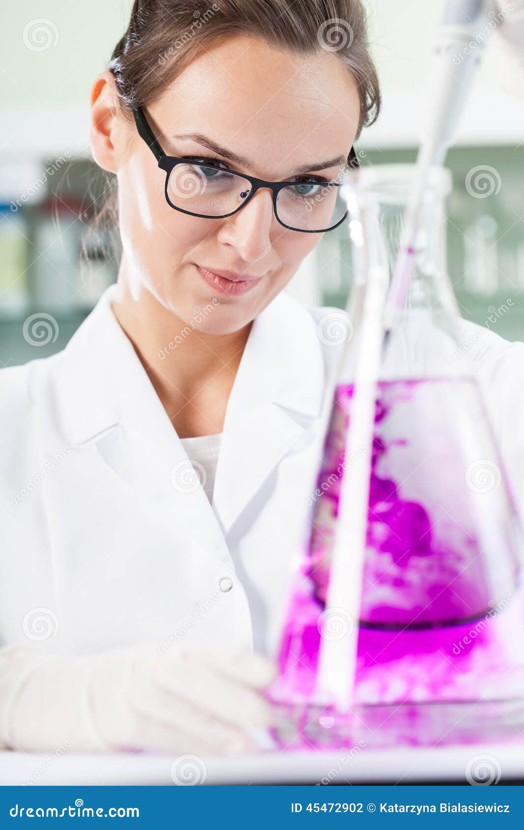 Scientist Putting Violet Liquid into the Flask Stock Photo - Image of ...