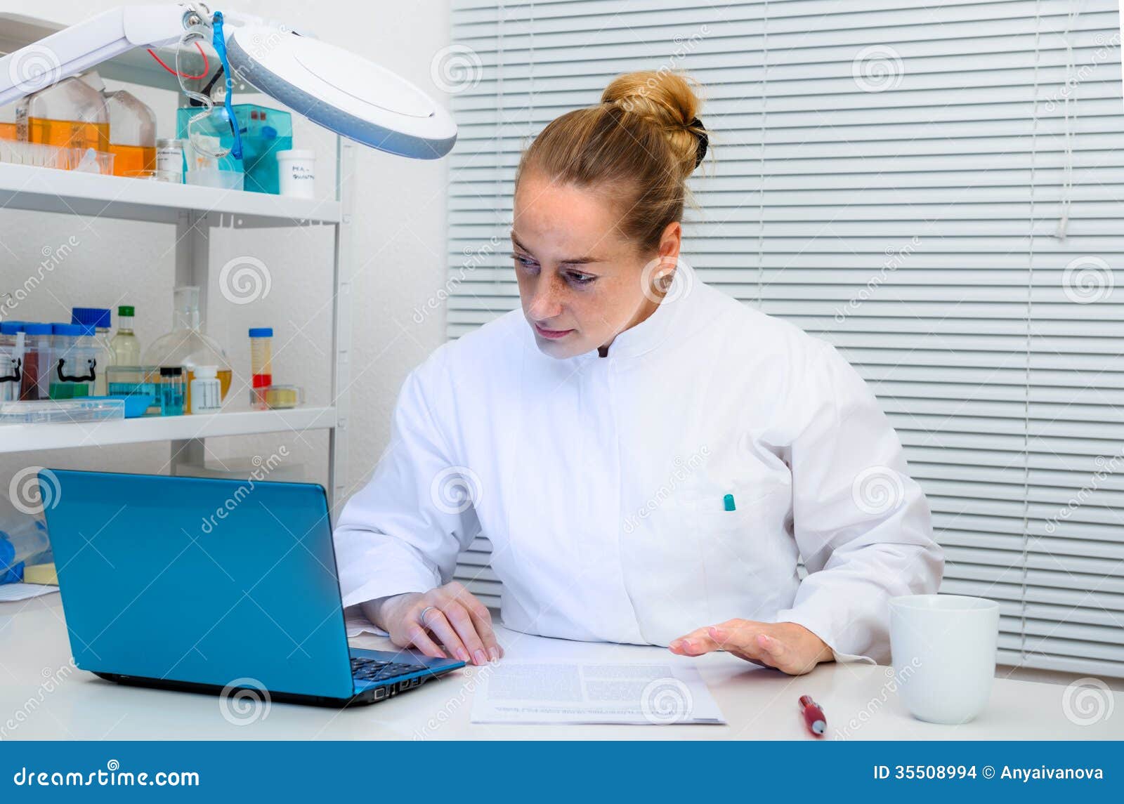 Scientist Reads Papers on Computer in the Lab Stock Photo - Image of ...