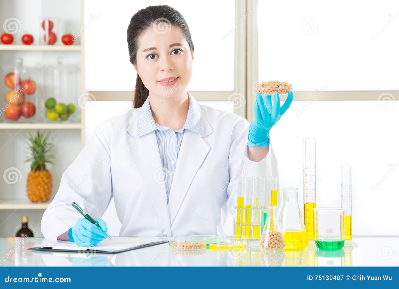 Scientist Recording Genetic Modification Data from Examining Stock ...